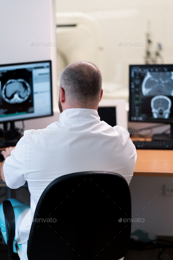 patient undergoes computed tomography radiologist monitors the ...