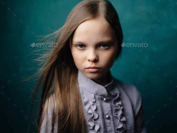 Girl in dress long hair studio green background close-up Stock Photo by shotprime