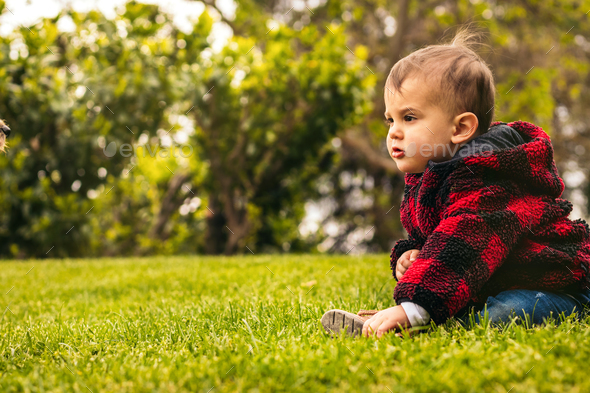 adorable baby boy with angry face sitting Stock Photo by pedrom97 ...