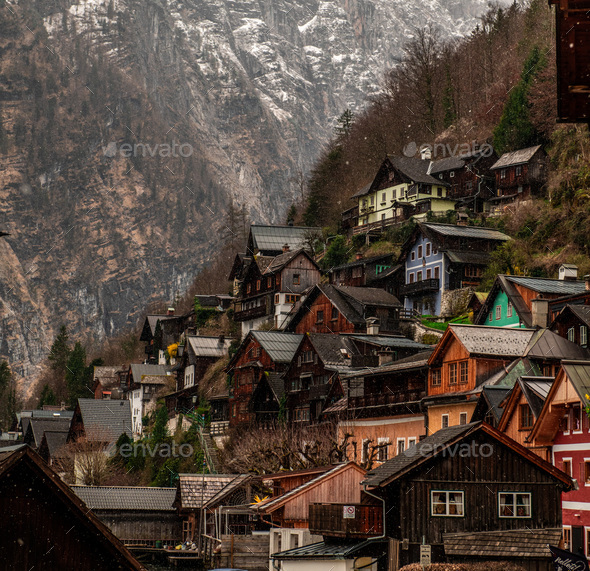 Scenic view of a small rural town with wooden houses in snowy mountains ...