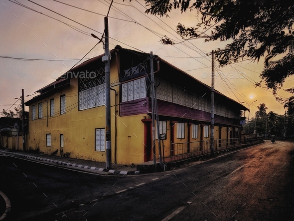 a colorful building on a quiet street in an urban setting Stock Photo ...