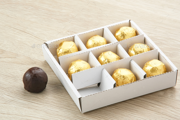 Chocolate candies with dates fruit filling Stock Photo by tyasindayanti