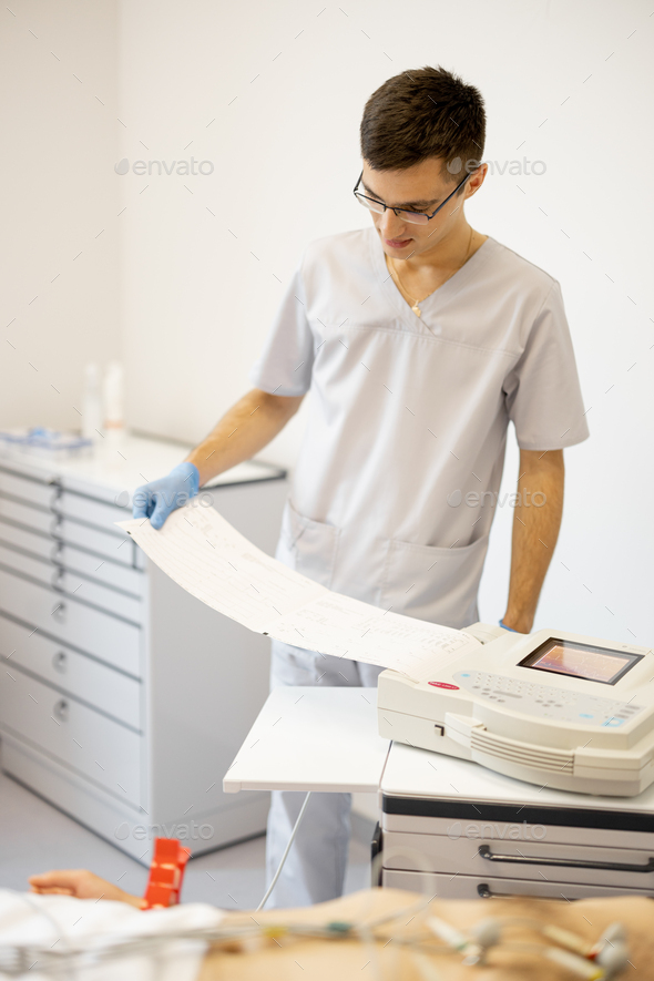 Cardiogram procedure in the clinic Stock Photo by RossHelen | PhotoDune