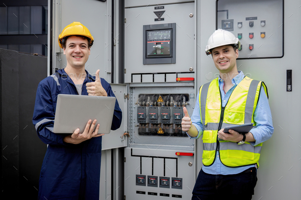 Electrical engineer working in control room. Stock Photo by kckate16