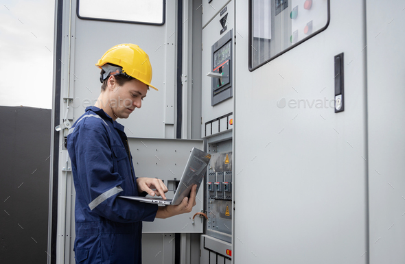 Electrical engineer working in control room. Stock Photo by kckate16