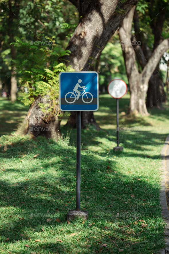 Signage for bicycle lanes in public parks. Stock Photo by eddows_arunothai