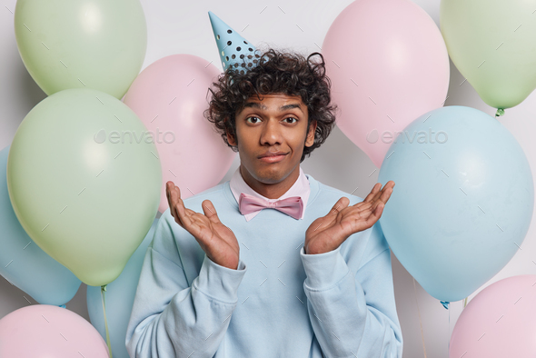 Birthday celebration concept. Indoor photo of young confused Hindu ...