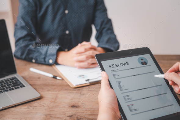 HR managers are interviewing job applicants who fill out their resume ...