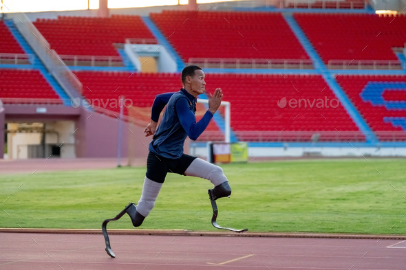 Asian para-athletes with prosthetic blades sprint on a running track at ...