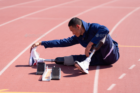 Asian para-athletes with prosthetic blades sprint on a running track at ...