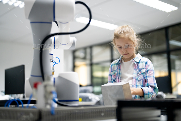 Student working with robot for science project. Students studying ...