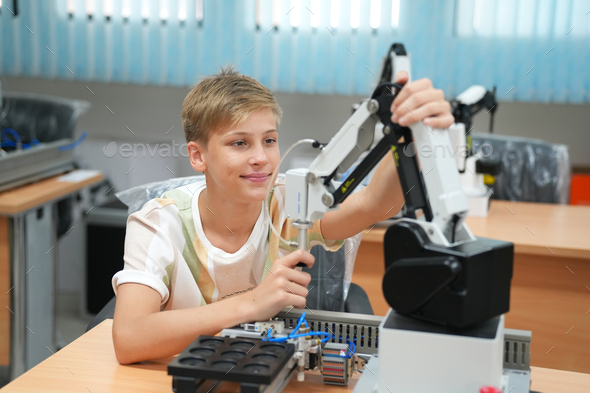 Student working with robot for science project. Students studying ...