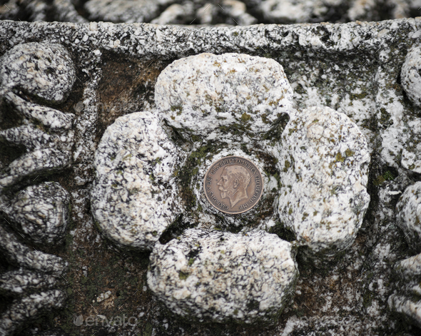 Old british penny coin on a stone background Stock Photo by SvarunPogani