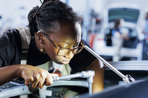 Engineer fixing car with lamp light aid Stock Photo by DC_Studio ...