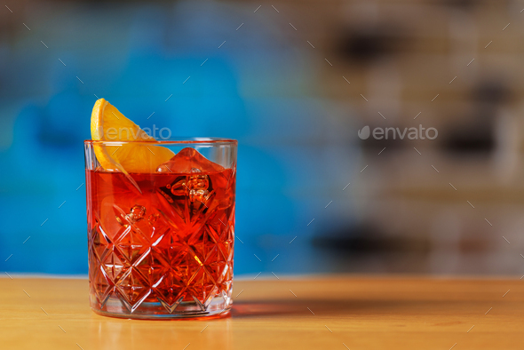 Cocktail allure: Classic negroni cocktail on a bar table Stock Photo by ...