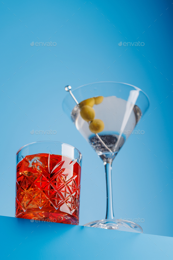 Cocktail delight: Vibrant drinks against a cool blue background Stock ...