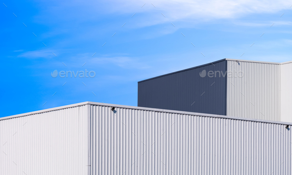 Modern white and gray aluminium industrial factory buildings against ...