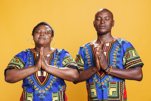 Couple standing with folded palms Stock Photo by DC_Studio | PhotoDune