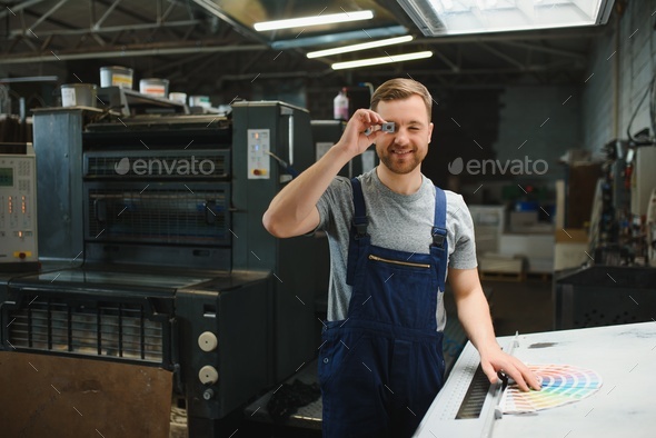 production line worker controlling manufacturing process of modern ...