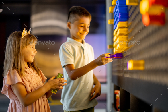 Kids playing in science museum Stock Photo by RossHelen | PhotoDune