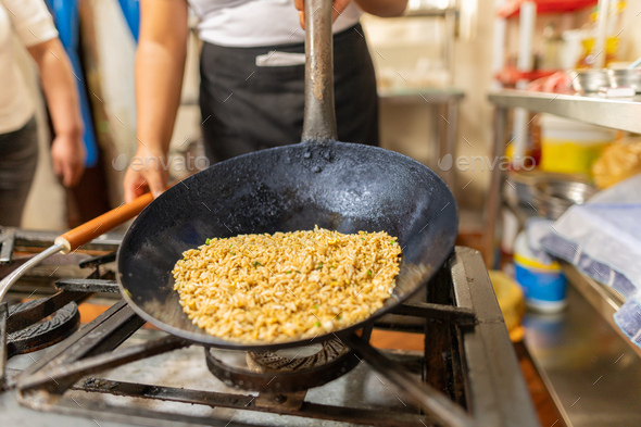 Pan with rice while chef preparing Chaufa peruvian dish Stock Photo by ...