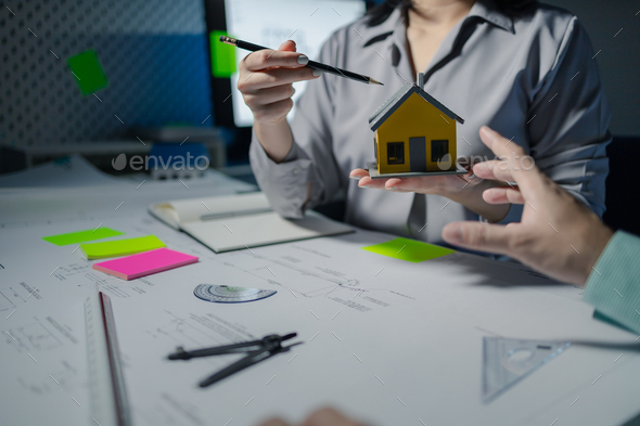 Architects are reviewing plans together, Construction and structure of ...