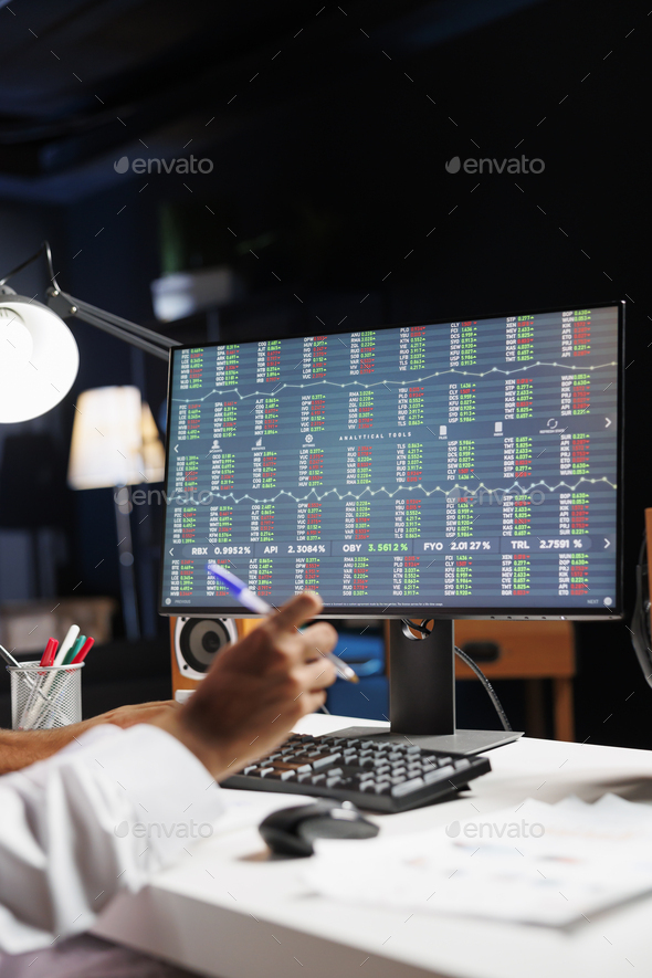 PC monitor displaying financial reports Stock Photo by DC_Studio ...