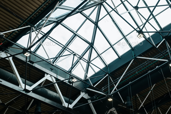 Iron roof structure with glass window indoors. Architecture of roof of ...