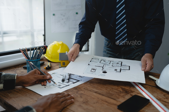 Structural engineer team discussing and calculating work Office design ...