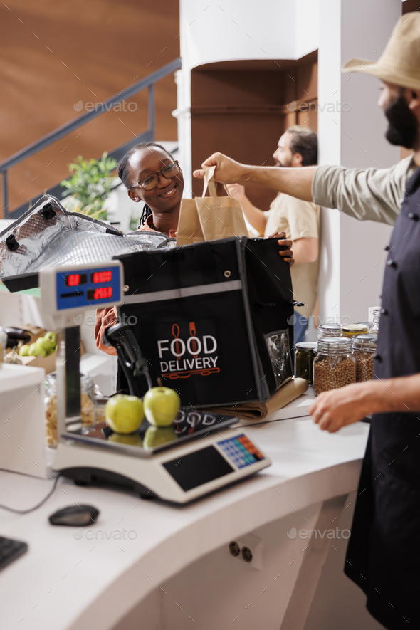 Delivery woman ready for sending orders Stock Photo by DC_Studio ...