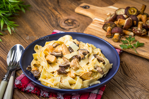 Tagliatelle pasta with forest mushrooms and chicken. Stock Photo by ...