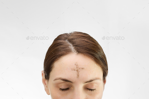 Woman with cross made from ash on forehead. Ash wednesday concept ...