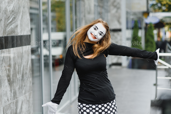 The girl with makeup of the mime. improvisation. mime shows different ...