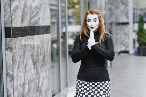The girl with makeup of the mime. improvisation. mime shows different ...