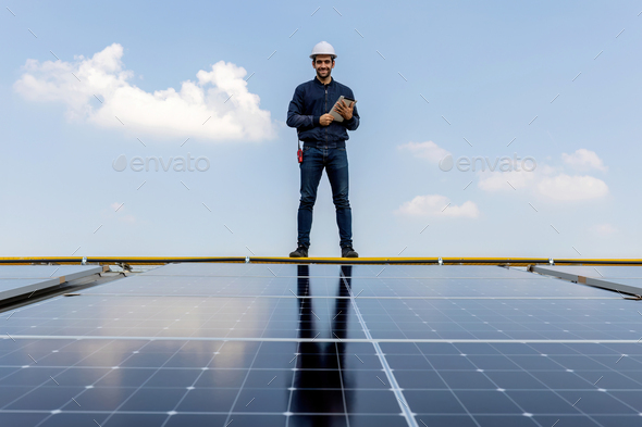 Engineer working setup Solar panel at the roof top. Stock Photo by kckate16