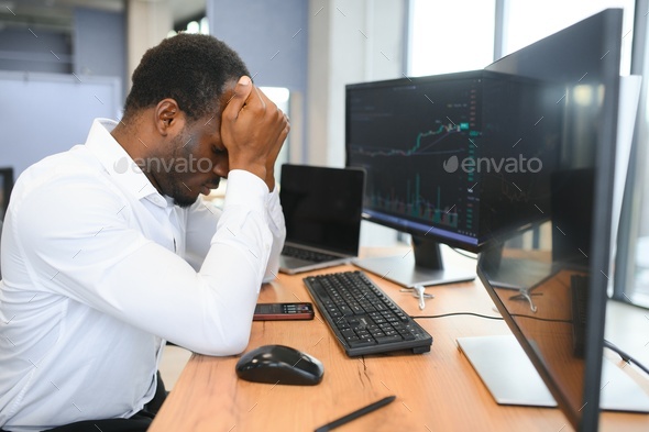Sad African trader has failed in business. Stock Photo by sedrik2007