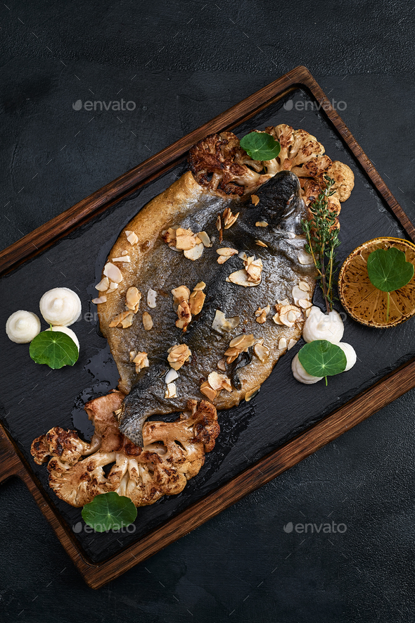 Fish dishes cooking preparation with dorado in backing form in shape of ...