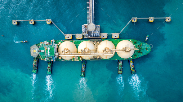 LNG (Liquefied natural gas) tanker anchored in Gas terminal gas tanks for storage. Oil Crude ...