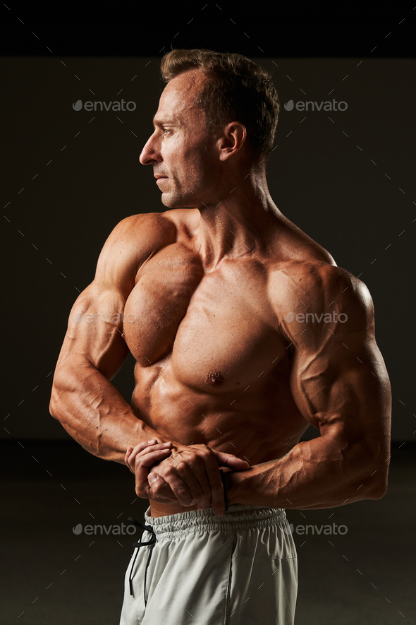 His muscles, a canvas for adrenaline, sculpted with intensity ...