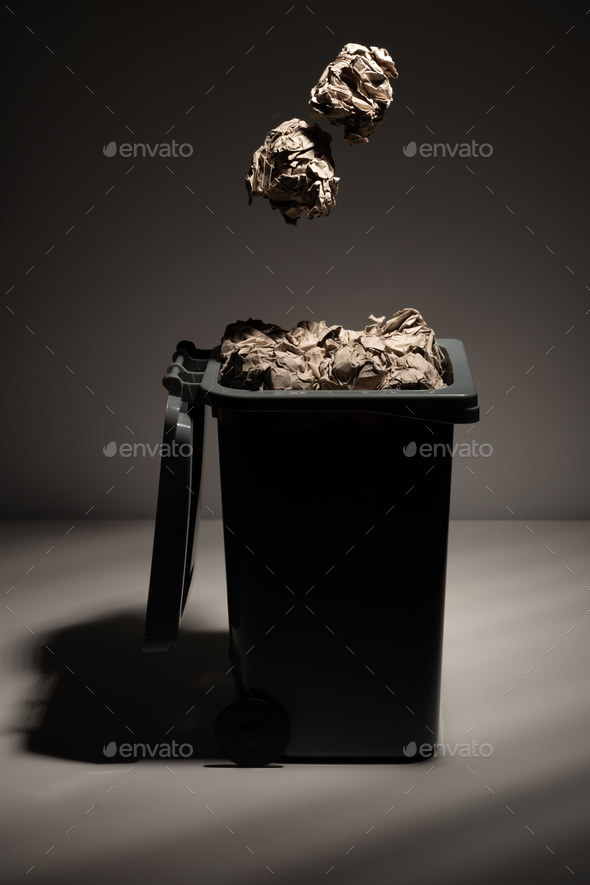Throwing paper in garbage bin Stock Photo by Pasanheco | PhotoDune