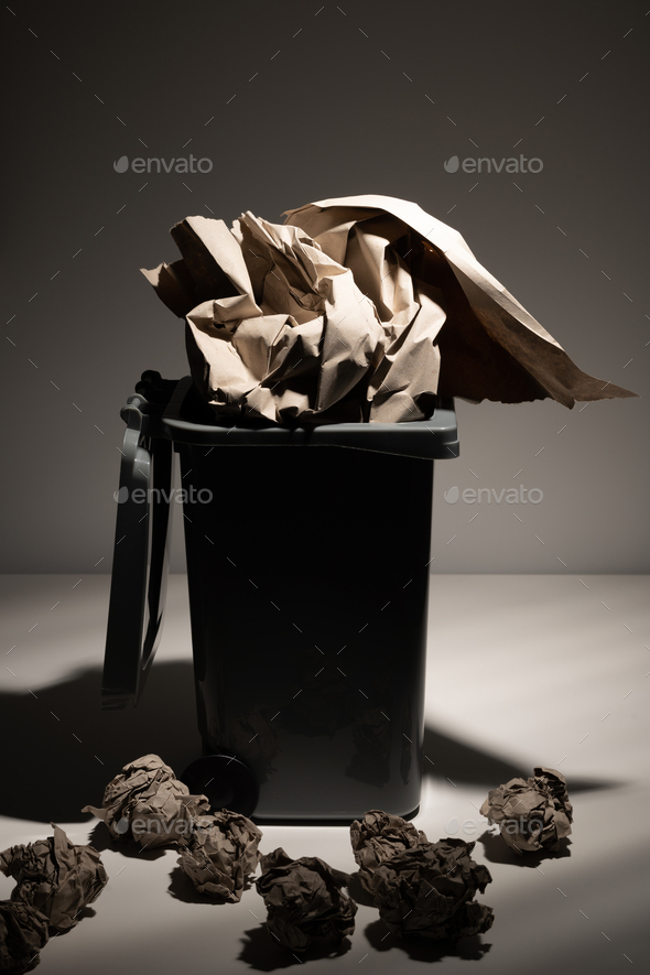 Throwing paper in garbage bin Stock Photo by Pasanheco | PhotoDune