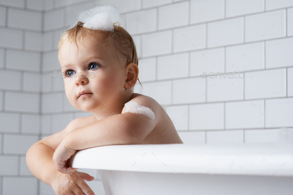 Hes having his bath before bed Stock Photo by YuriArcursPeopleimages
