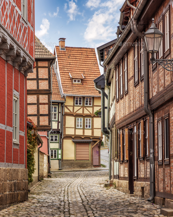 small cobblestone streets in europe with old buildings and lamps Stock ...