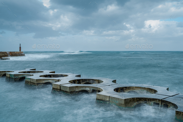 Breakwall positioned amidst the vastness of the ocean, featuring a ...