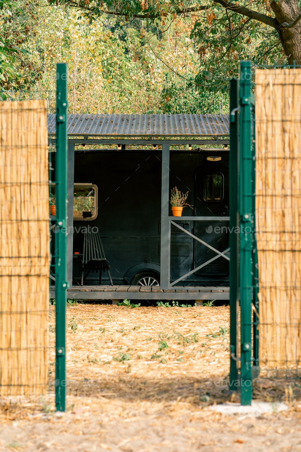 Gate entrance to glamping with mobile home and spacious terraces next ...