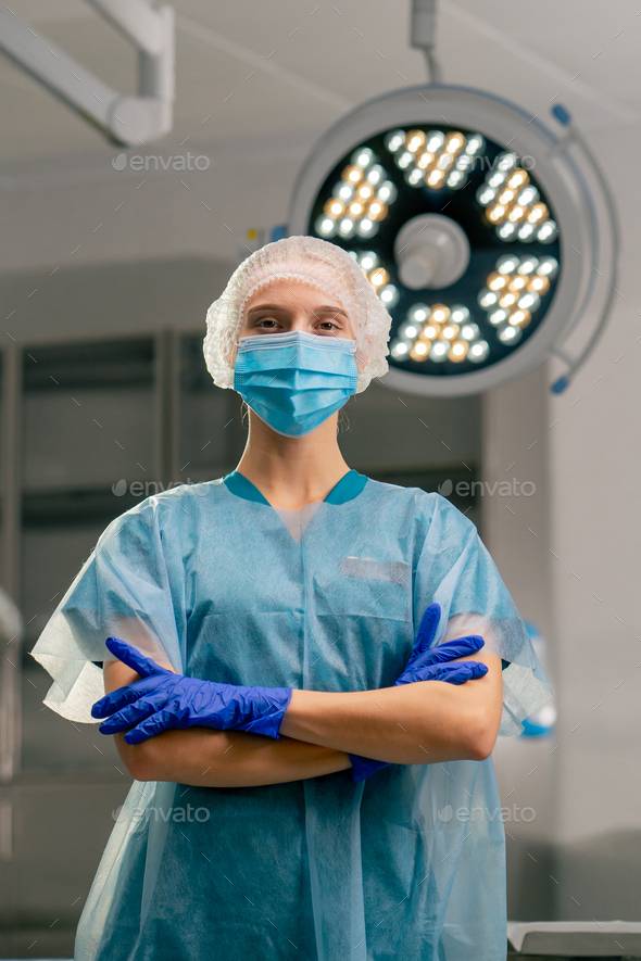 female anesthesiologist in uniform with her arms crossed in front of ...