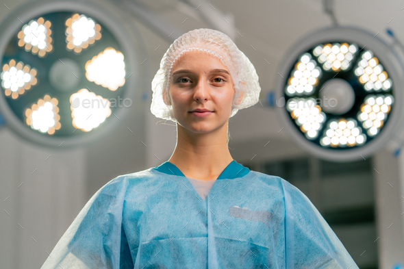 female anesthesiologist in uniform with her arms crossed in front of ...