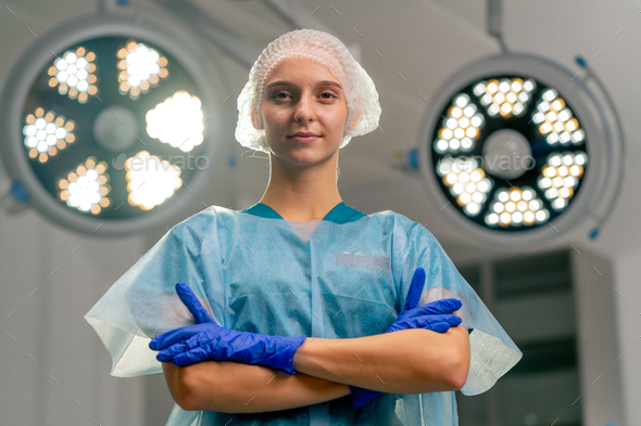 female anesthesiologist in uniform with her arms crossed in front of ...
