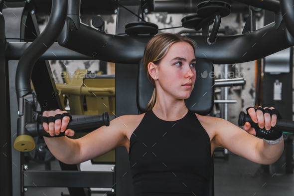 Gym.Fitness woman working out in the gym, doing exercises for health ...