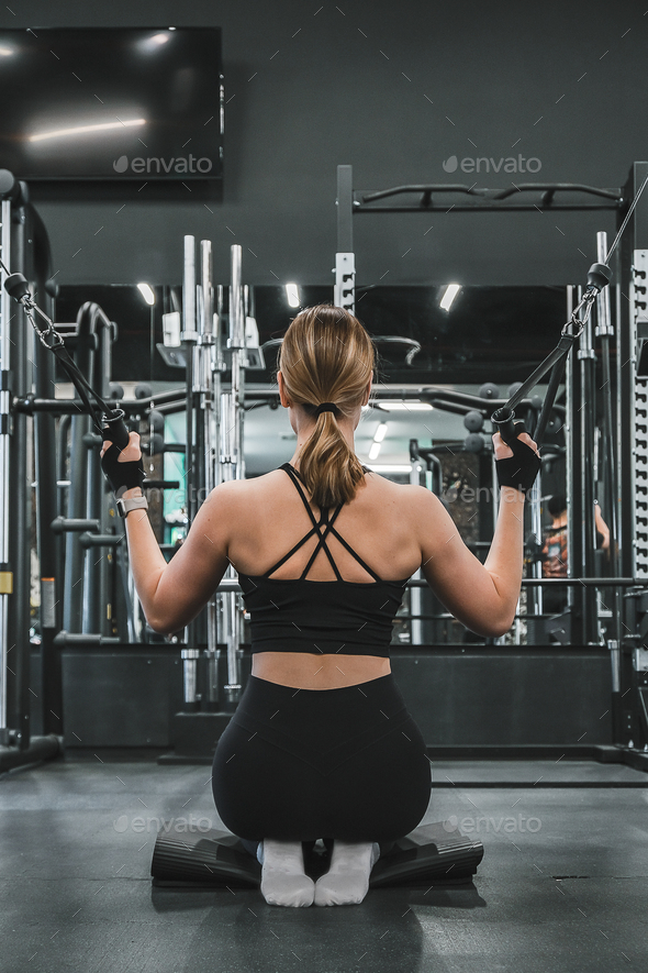 Gym.Fitness woman working out in the gym, doing exercises for health ...